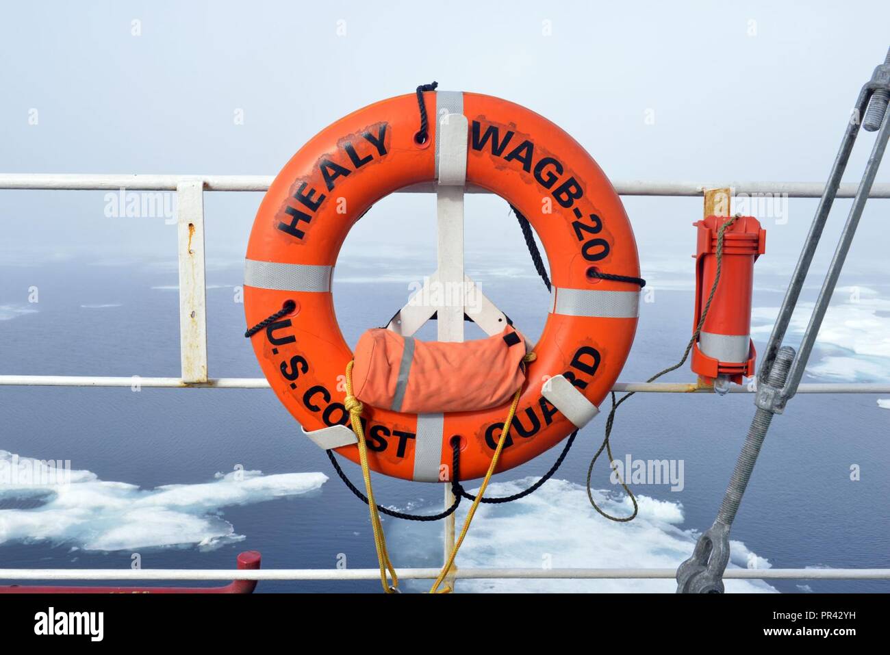 A life ring is mounted on a rail aboard the Coast Guard Cutter Healy ...