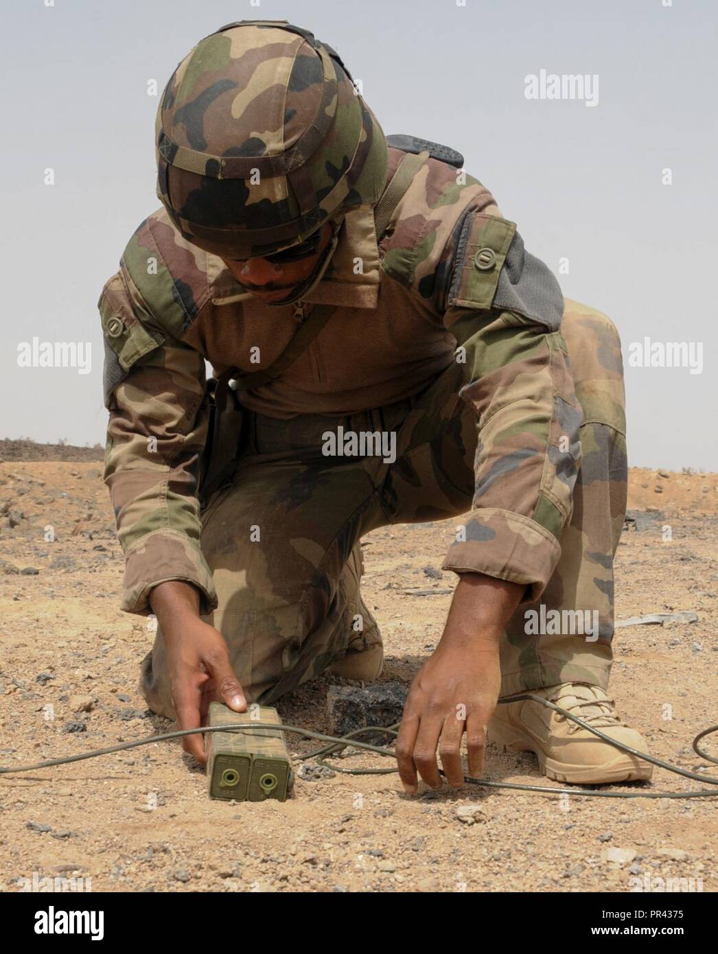 A French service member prepares C-4 at a range near Arta, Djibouti ...