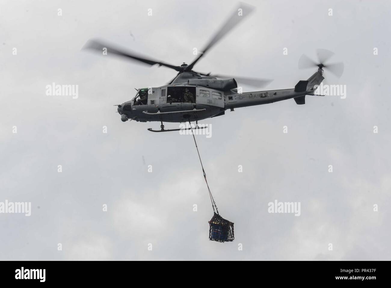 PACIFIC OCEAN – An UH-1Y Huey carries a pallet of supplies during ...