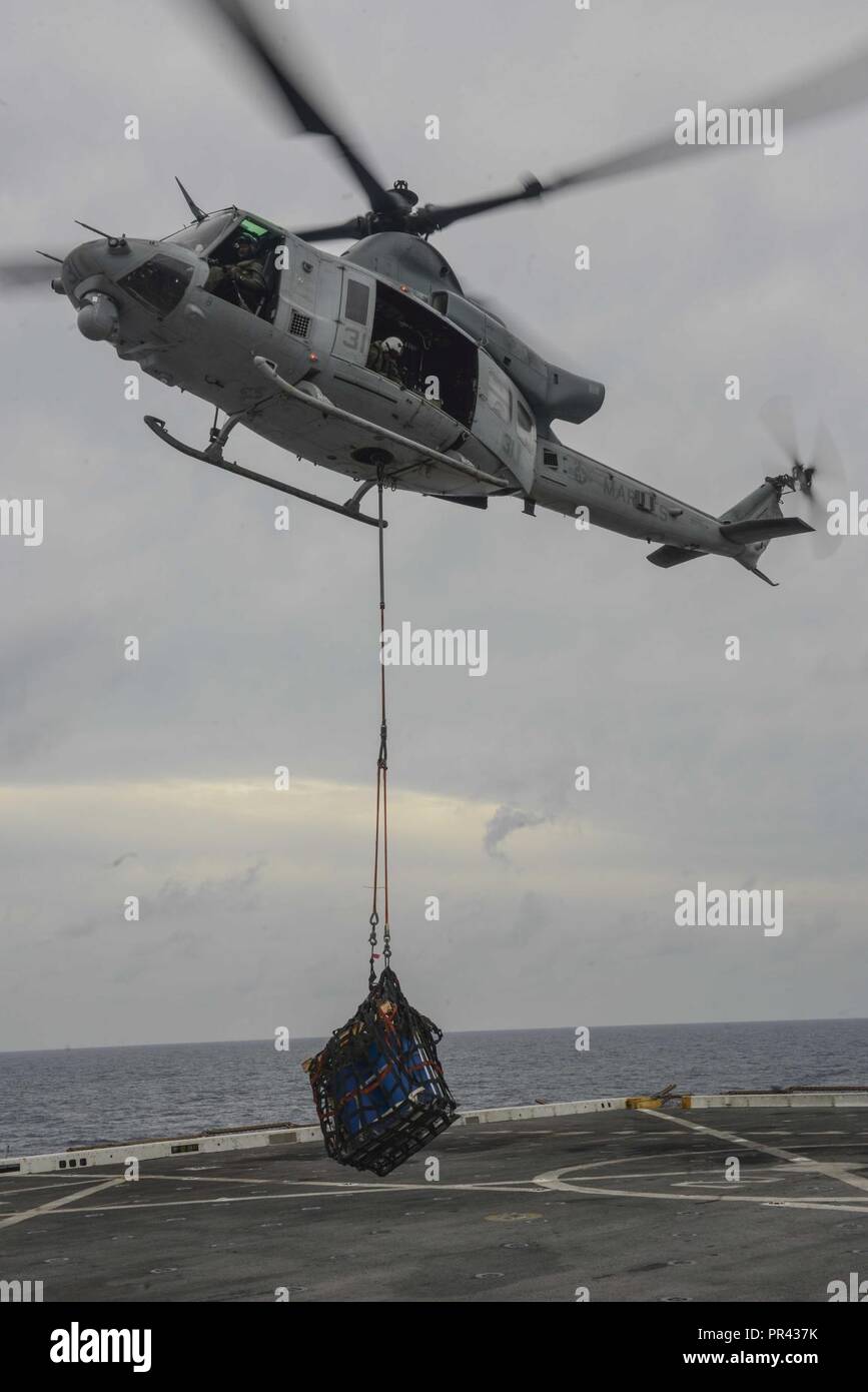 PACIFIC OCEAN – An UH-1Y Huey lifts a pallet of supplies from the ...