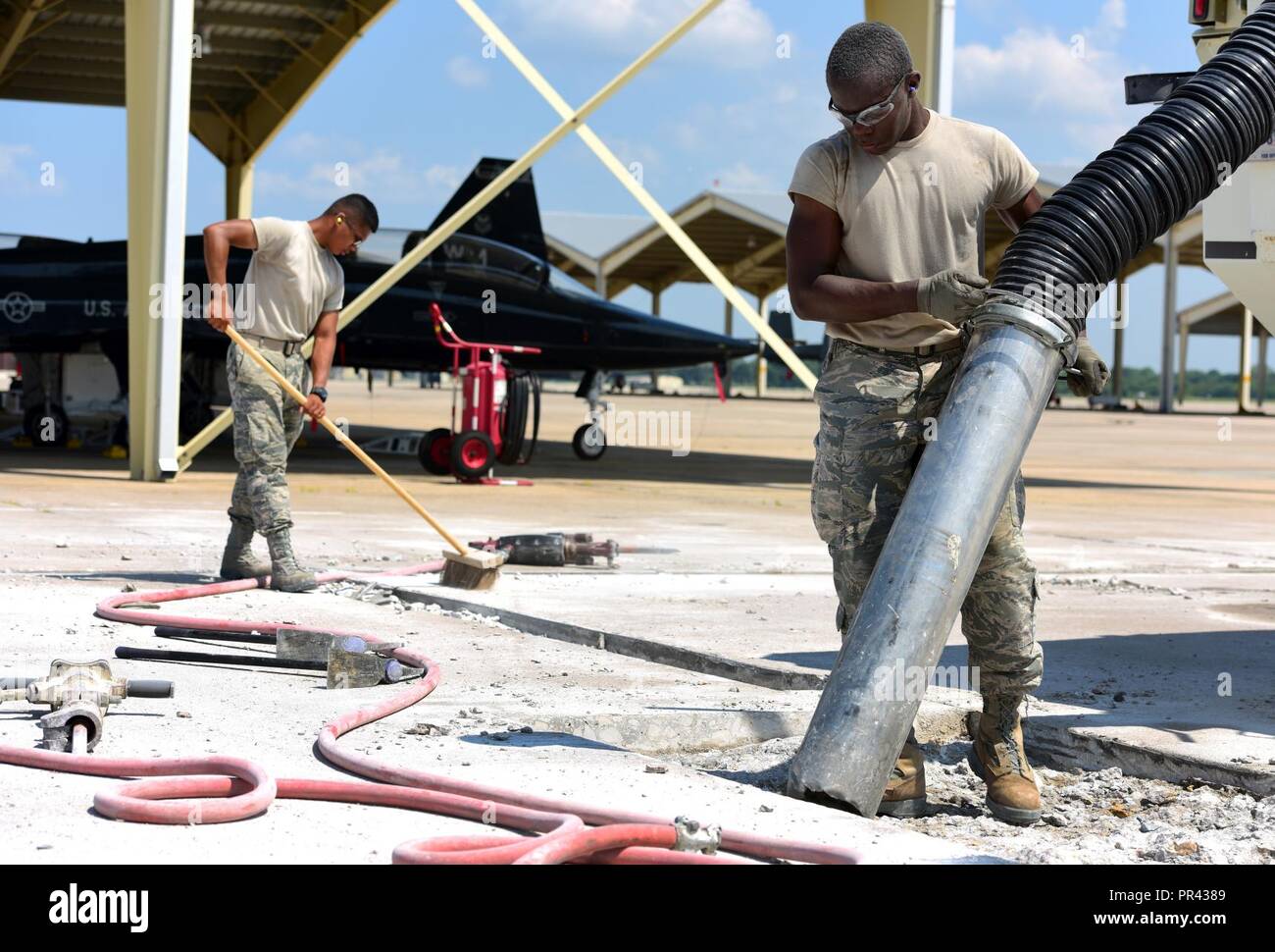 U.S. Air Force Airman Sean Guarin, left, and Airman 1st Class Devin ...