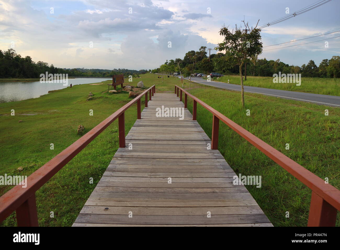 wooden bridge over a small shallow river flows into estuary Stock Photo ...