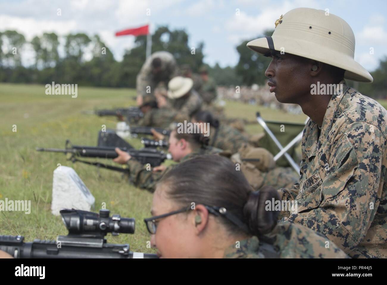 A U.S. Marine Corps primary marksmanship coach, with Marksmanship ...