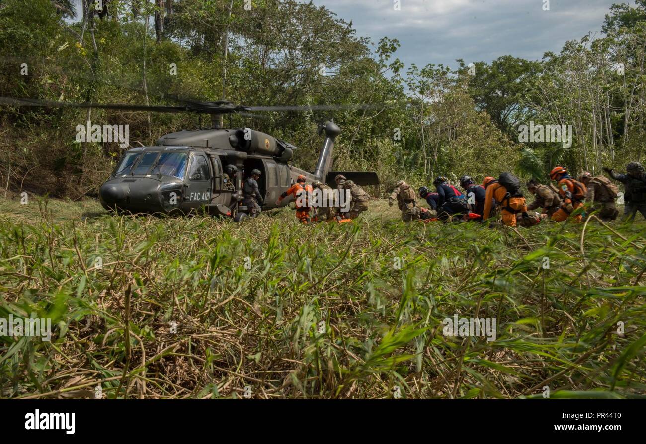 The Colombian civil defense team, firefighters and Peruvian Airmen load ...