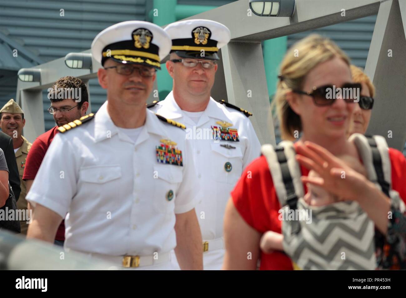 Lieutenant Commander Brian Ellis, USN, was promoted to the rank of ...