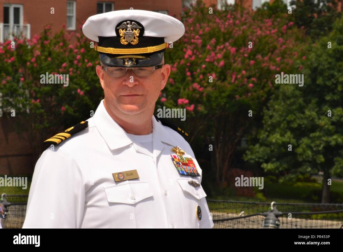 Lieutenant Commander Brian Ellis, USN, was promoted to the rank of ...