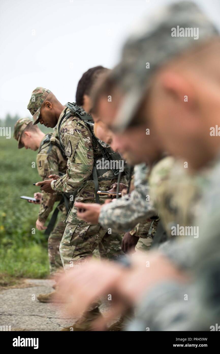 Servicemembers line up to start the ruck march portion of German Armed ...
