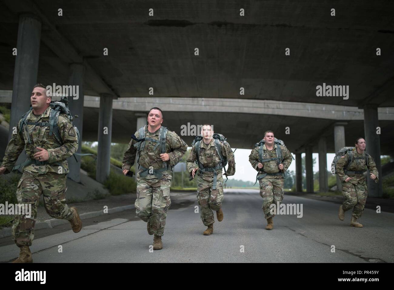 Servicemembers compete in a ruck march at Rosecrans National Air Guard ...