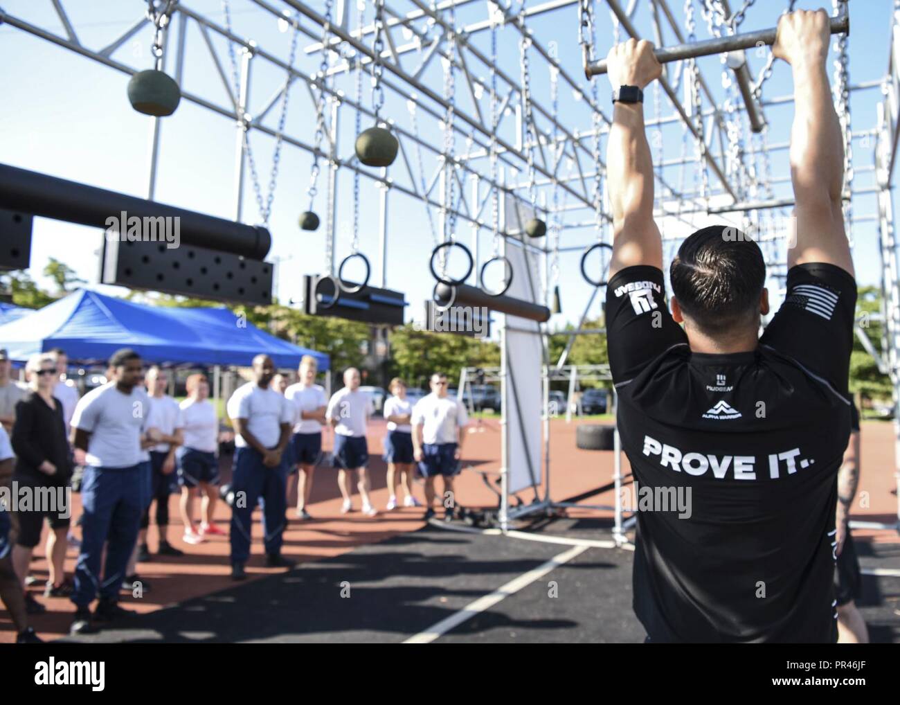 Chad Leath, Alpha Warrior fitness coach, demonstrates regressions to a ...