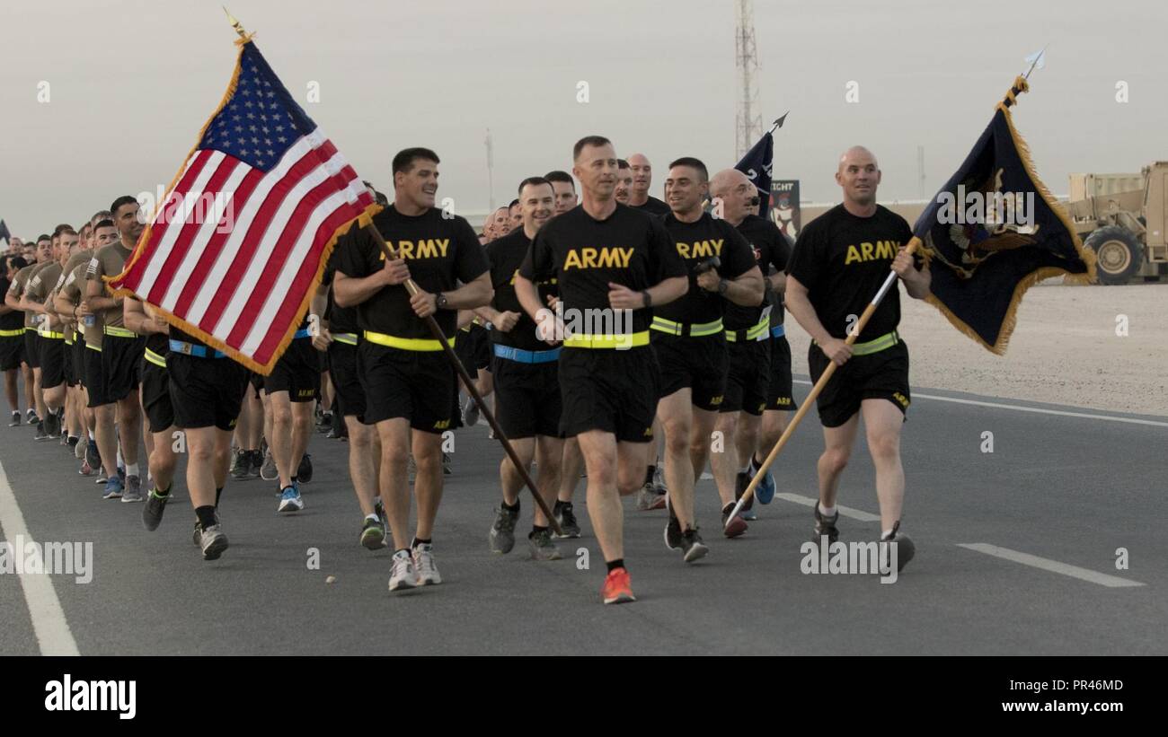 U.S. Army Soldiers run in formation at a 5K run to commemorate the 17th ...