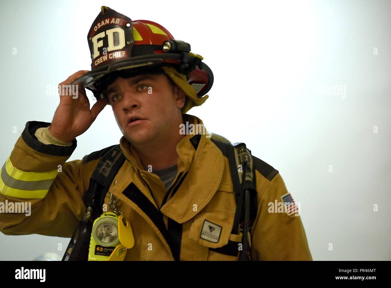 A U.S. Air Force firefighter assigned to the 51st Civil Engineer ...