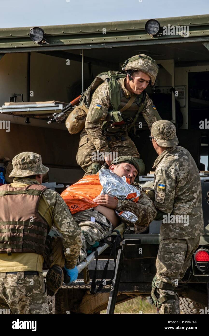 Ukrainian Soldiers conduct medevac during Rapid Trident 18 held at ...