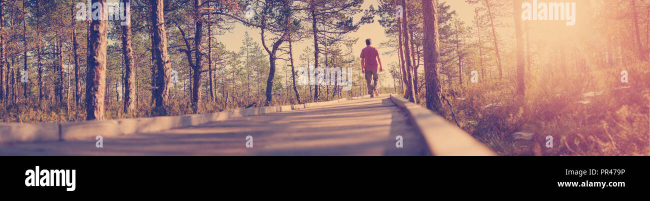 Man walking on the walkway hi-res stock photography and images - Alamy