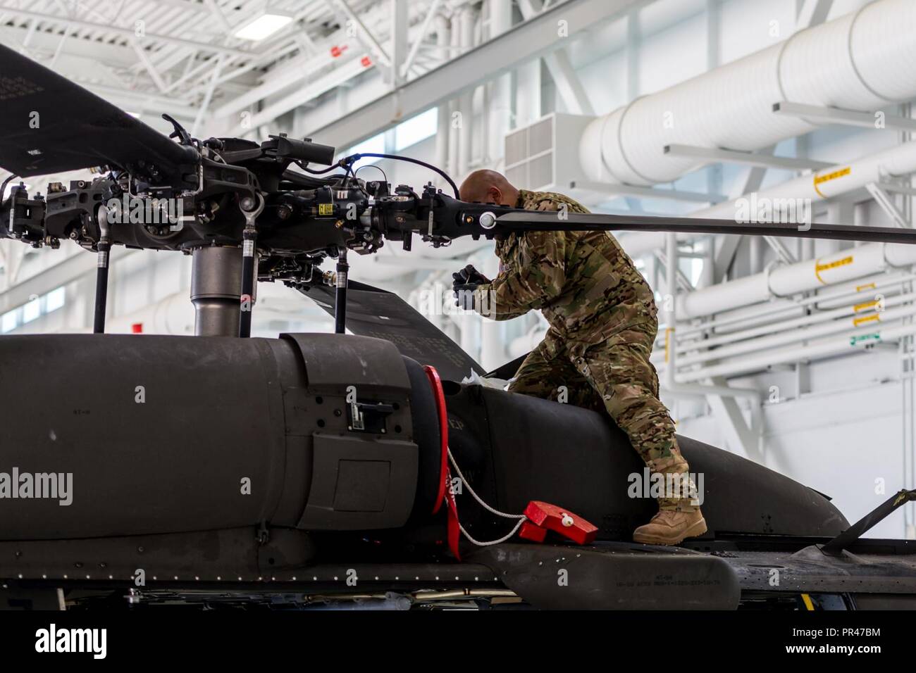 Sgt. Andres Salazar completes pre-flight inspections of the UH-60 ...