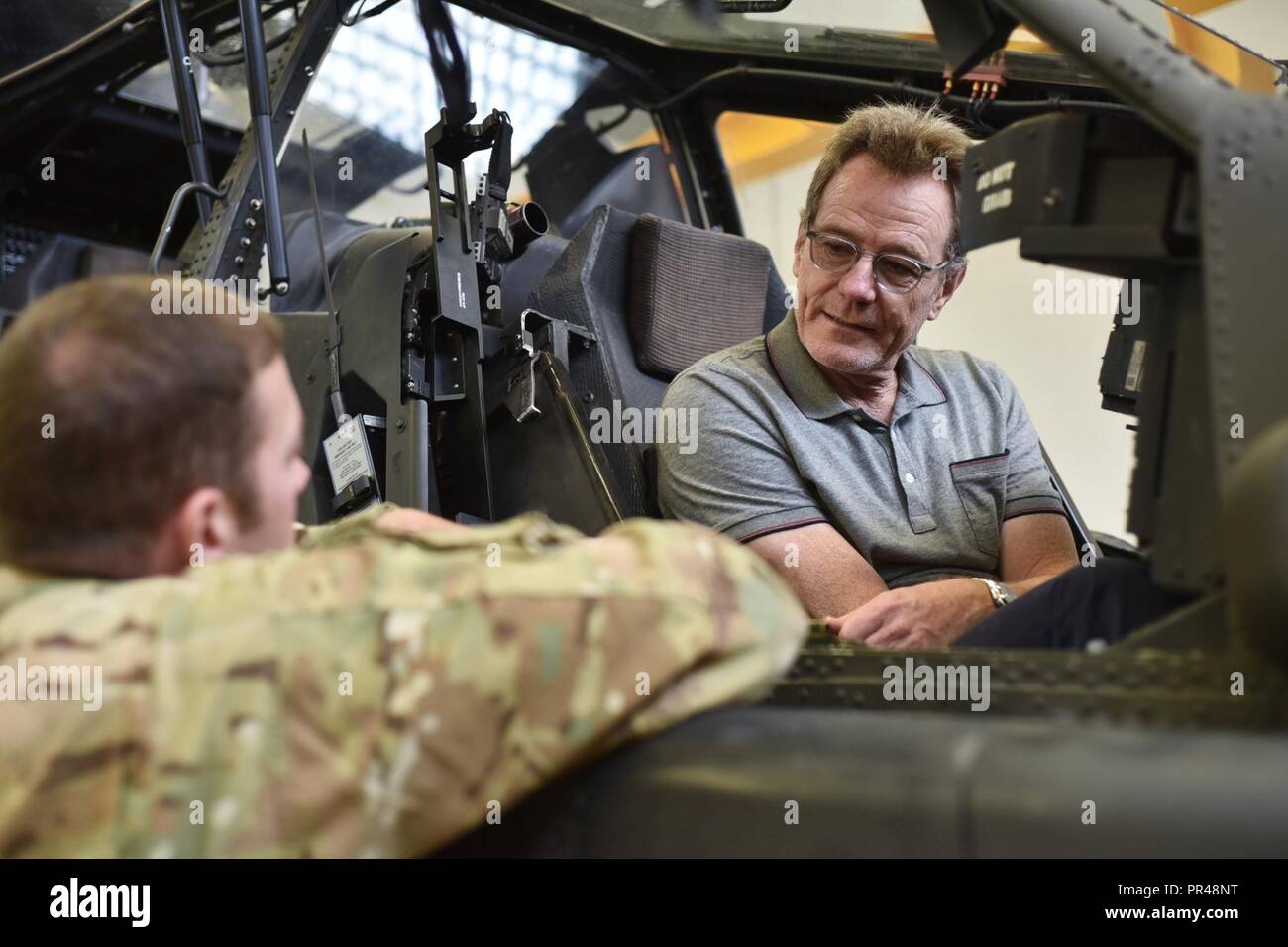 First Lt. Brandon Clayton, left, an AH-64 Apache pilot with the 12th ...