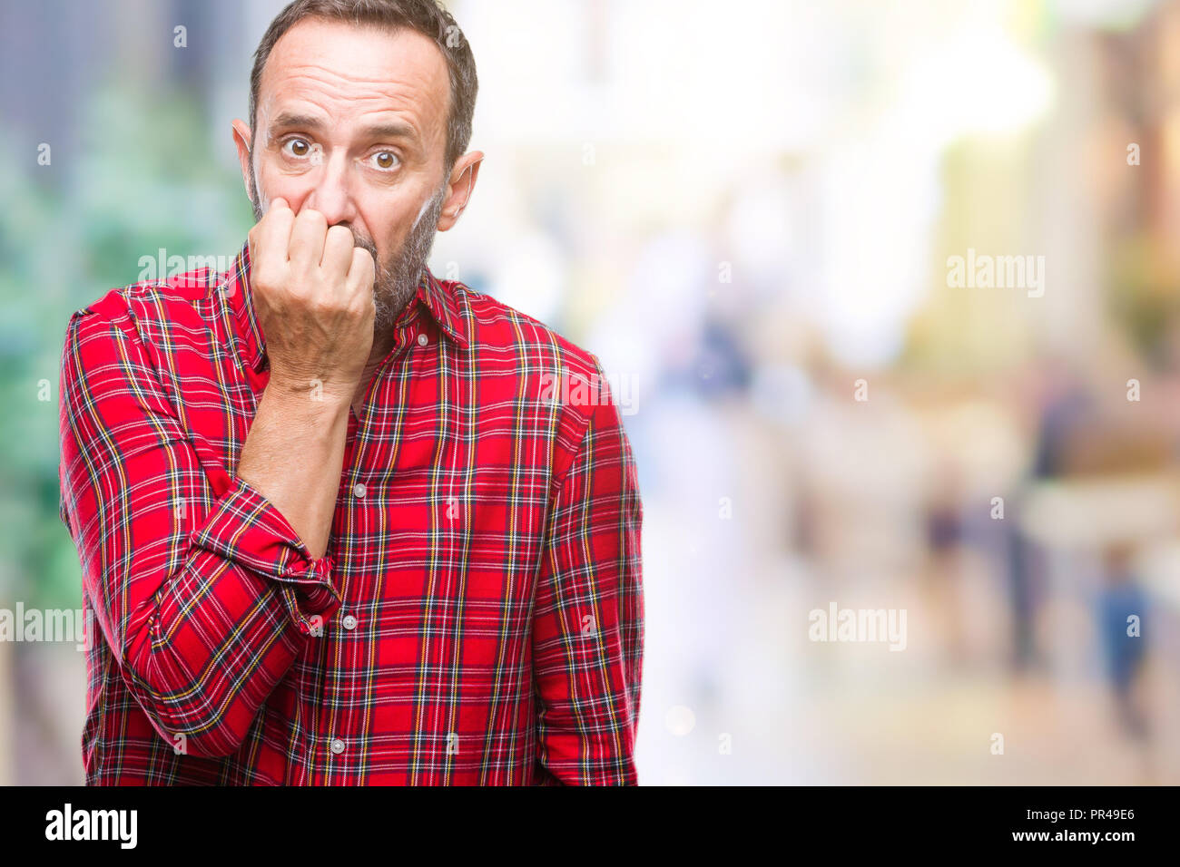 Middle age hoary senior man over isolated background looking stressed ...