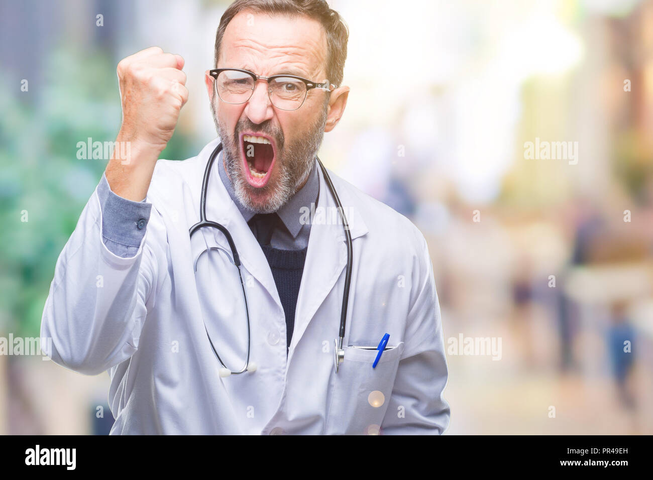 Middle age senior hoary doctor man wearing medical uniform isolated ...