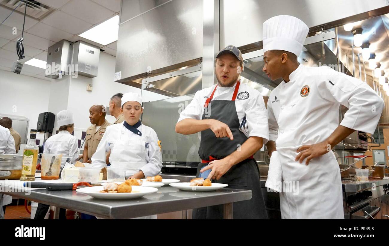 U.S. Marine Corps Sgt. Darnell Morris, right, enlisted aide to the ...