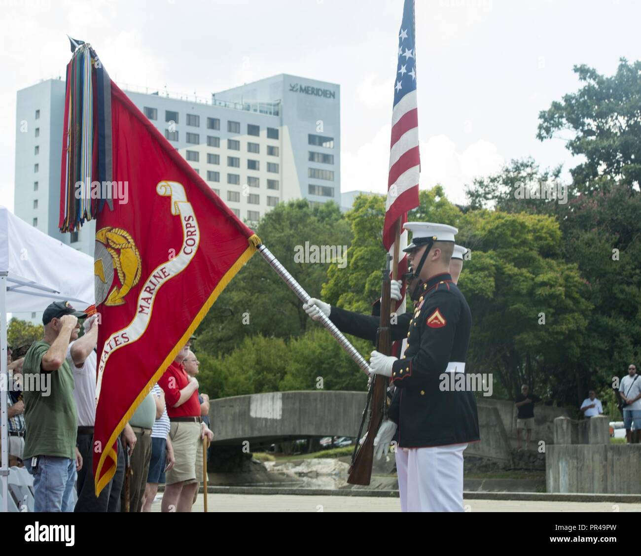 Local Vietnam veterans stand at attention for the flag during a Vietnam ...