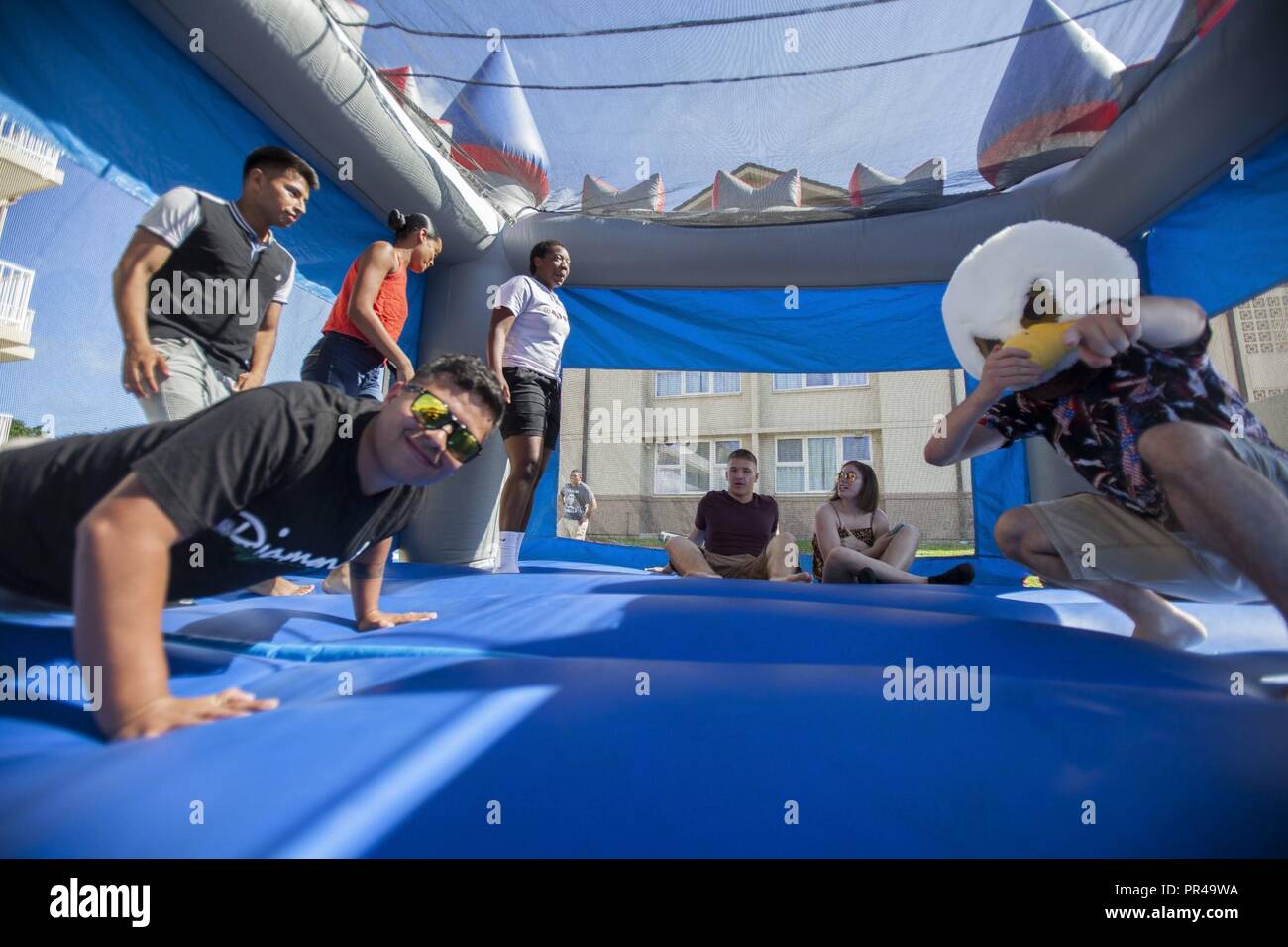 U.S. Marines with Headquarters Battalion (HQBN), Marine Corps Base Hawaii (MCBH), pose for a ...