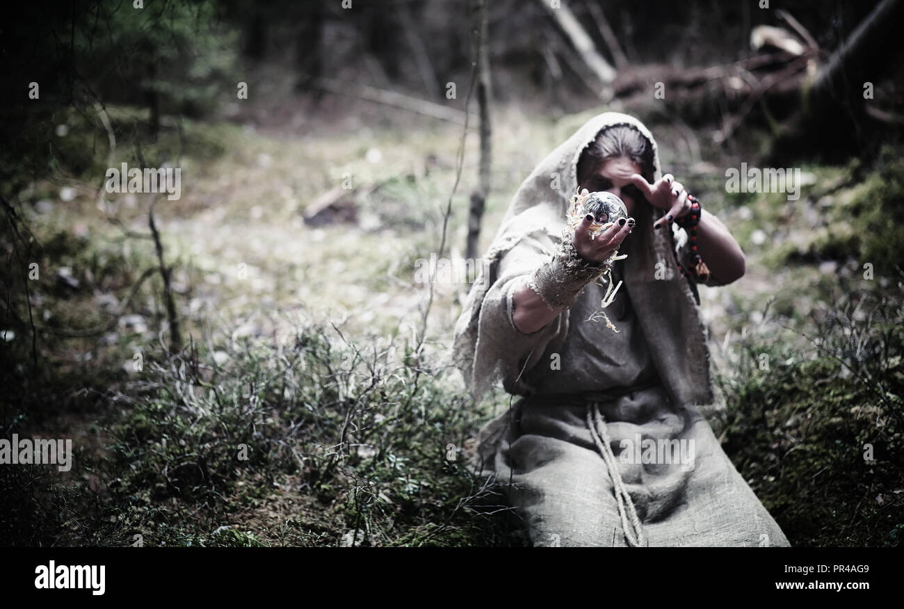 Fairy magician. A sorcerer with a glass sphere, a magical spell Stock ...