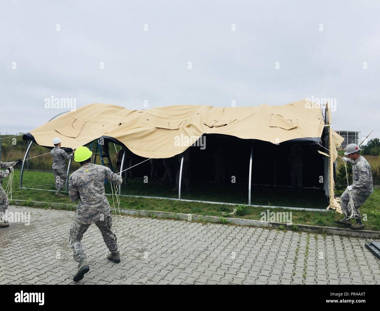 Airmen work together to setup tent city during the Deployable Air Base ...