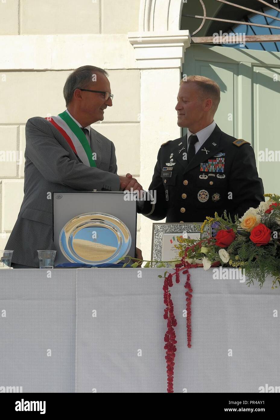 US Army Garrison Italy Commander Col. Erik Berdy shakes hands with ...