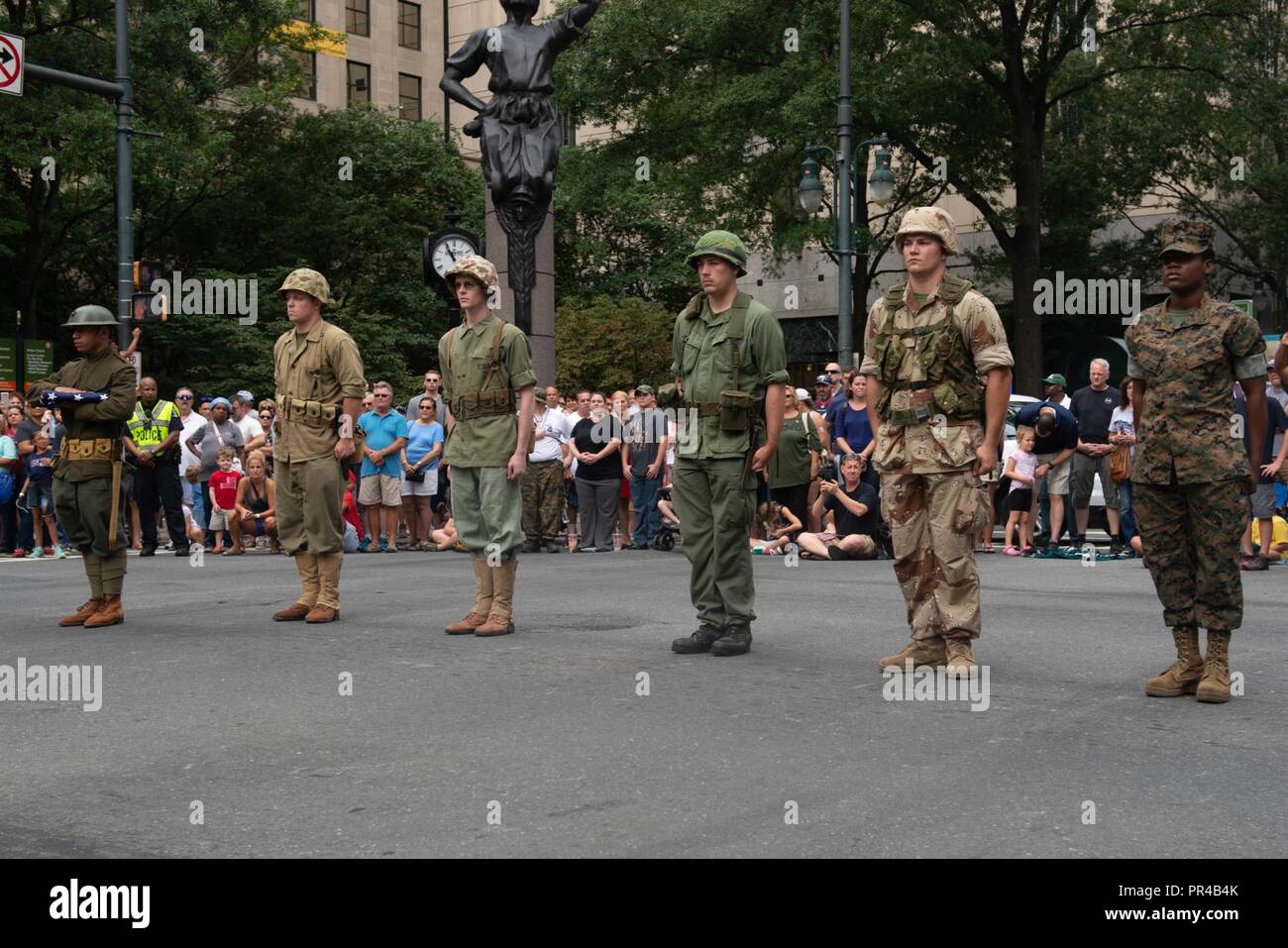 A detail of Marine Corps Uniform Pageant Marines stands before the ...