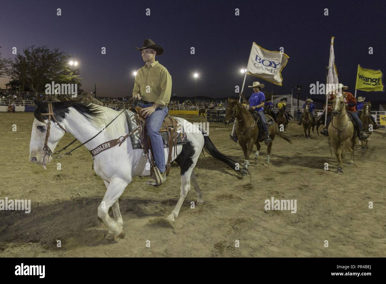 U.S. Marine Corps Col. Craig C. Clemans, base commander, rides in the ...