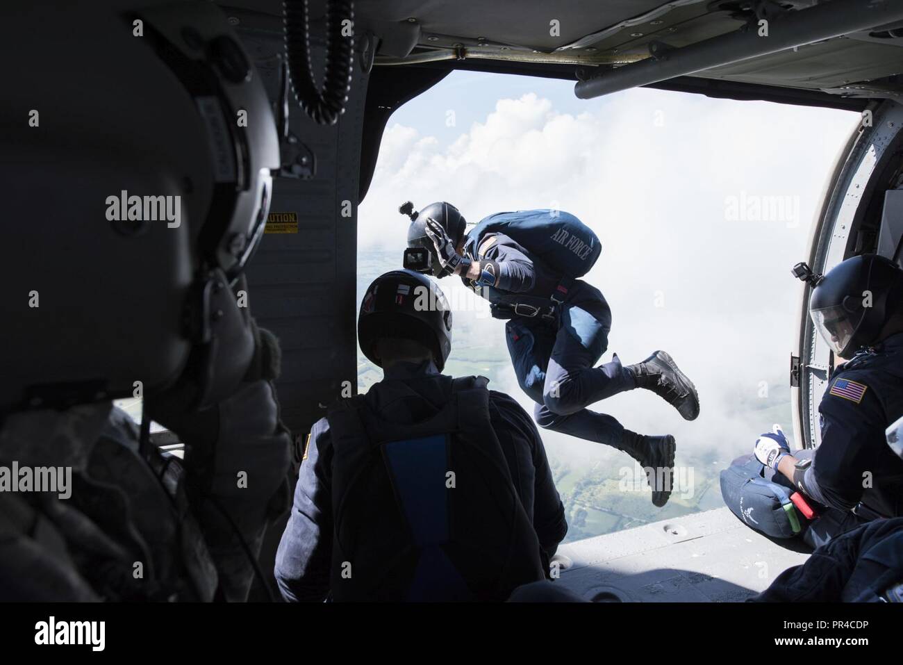 Members of the US Air Force Parachute Team, the Wings of Blue, perform ...