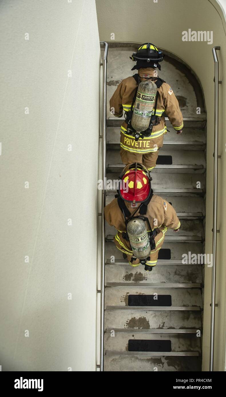 U.S. Air Force Senior Airman Forrest Privette, top, 18th Civil Engineer ...
