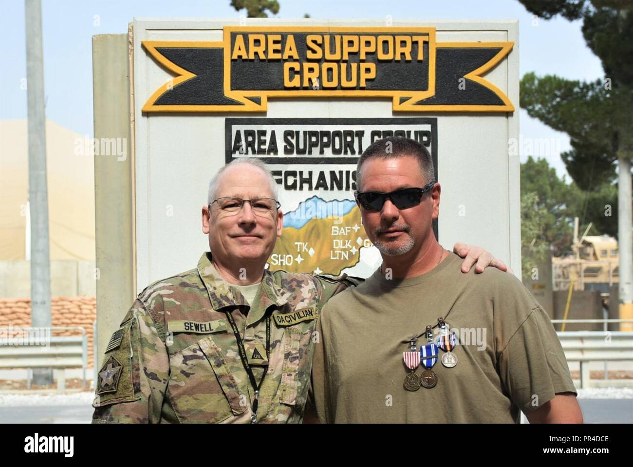 (From right) Department of the Navy Civilian Jonathan Covington stands ...