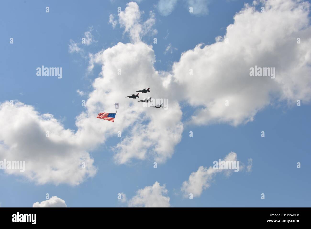 F-16 flyover and Aerial flag for the opening and national anthem of the ...