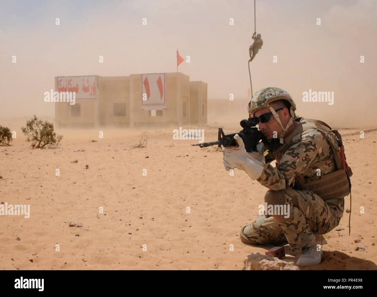 A Jordanian Special Operations Forces soldier provides security as an ...