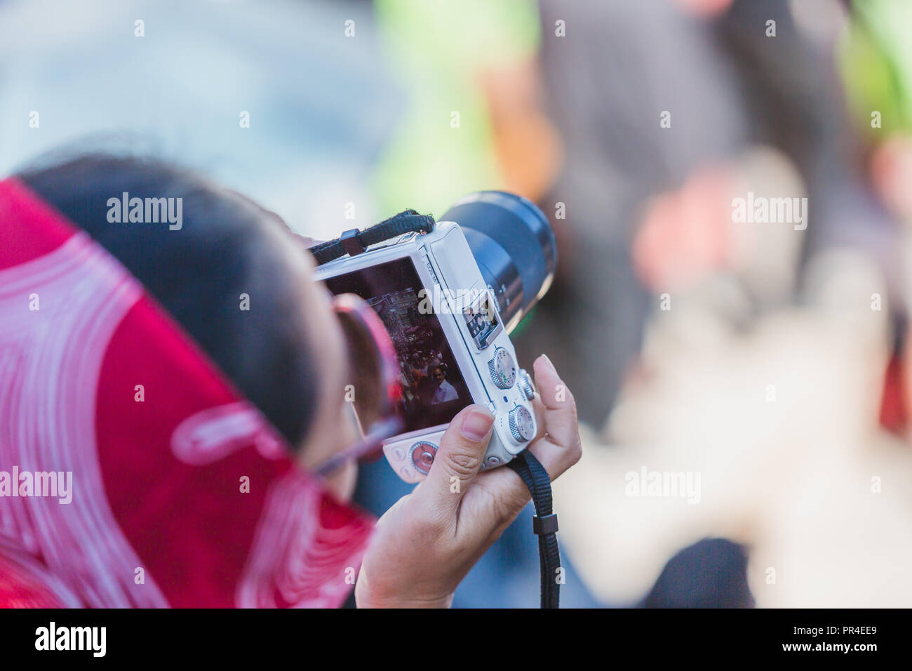Unknown People Taking Photos with Digital Camera in the crowd of people ...
