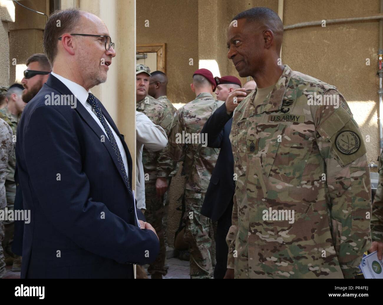U.S. Army Command Sgt. Maj. Michael Crosby, right, outgoing command ...