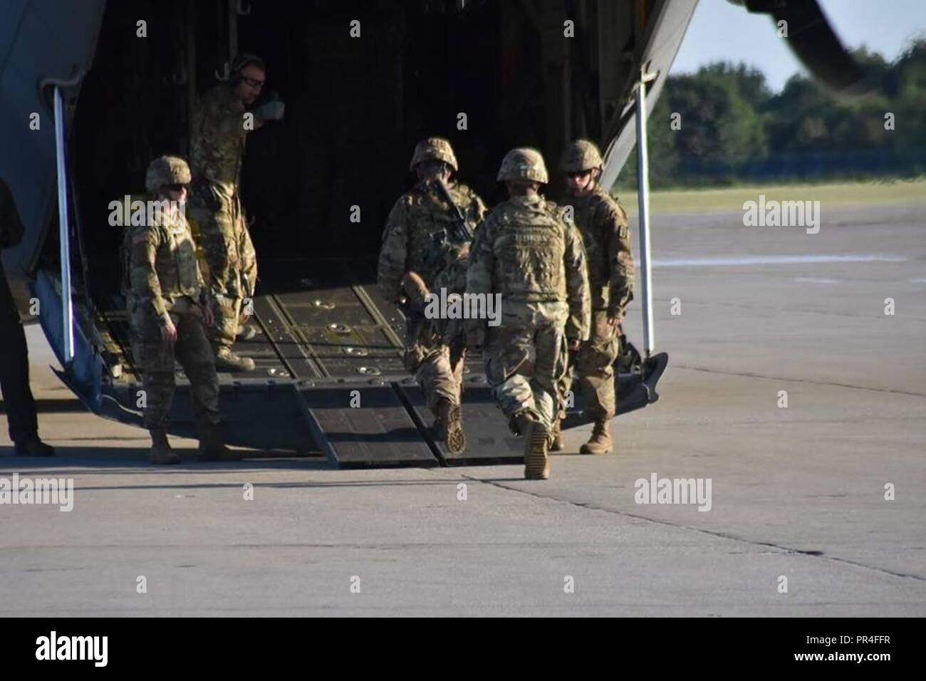 Simulated casualties being loaded on a C-130 used for strategic ...