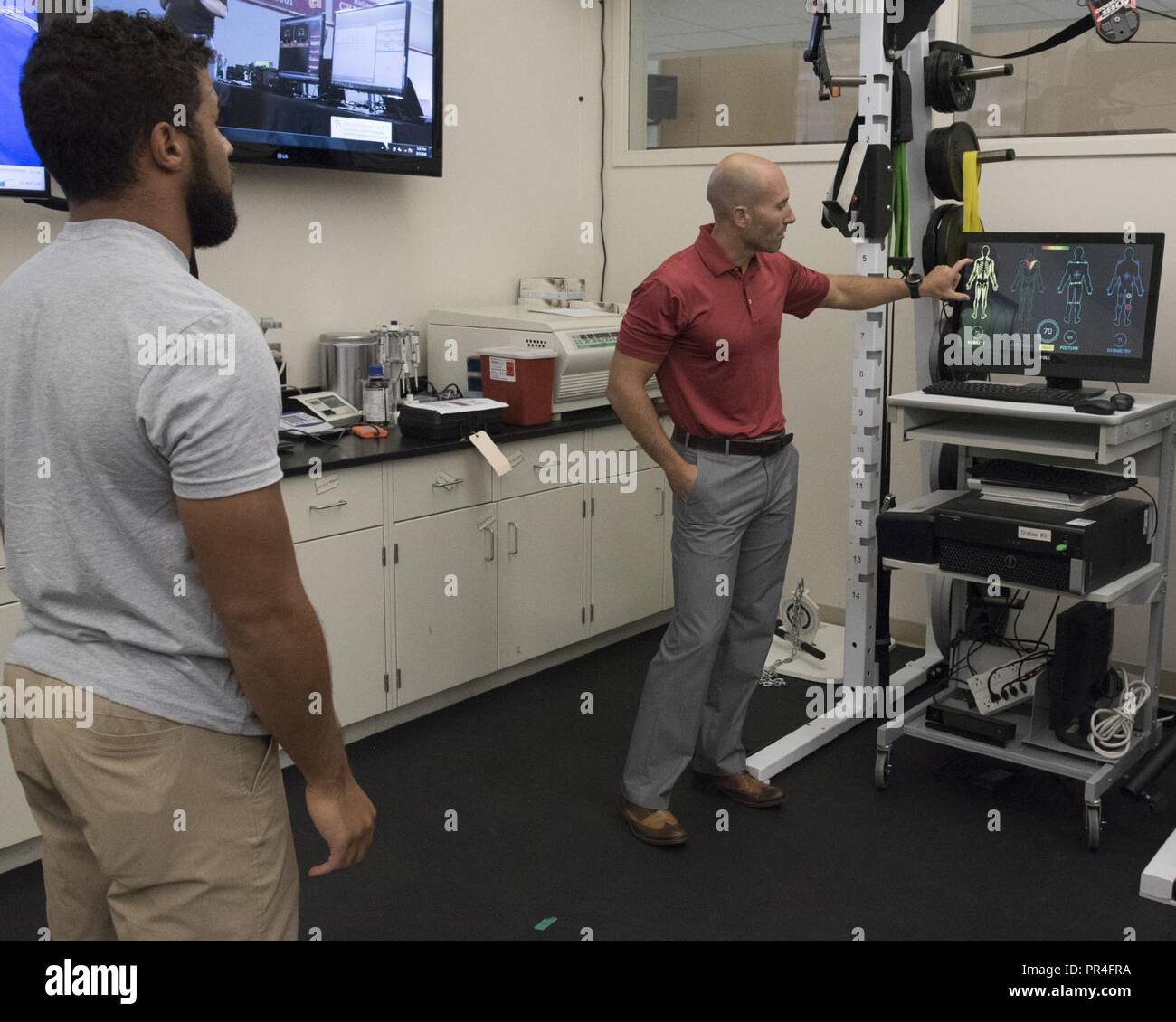 Dr. Adam Strang, 711th Human Performance Wing scientist, points to a ...