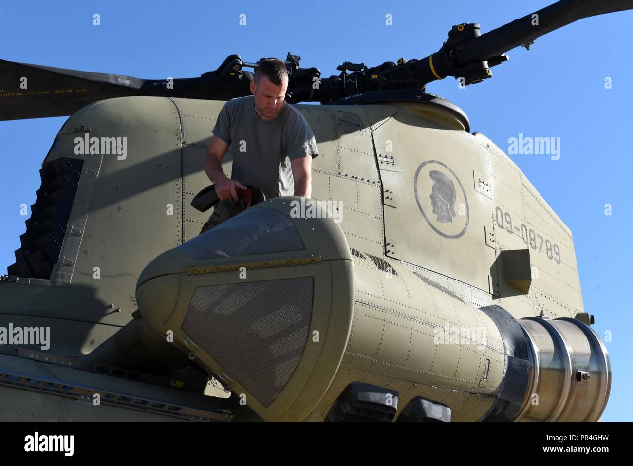 U.S. Army Sgt. Kyle Schneider, a flight engineer with Company B, 2nd ...
