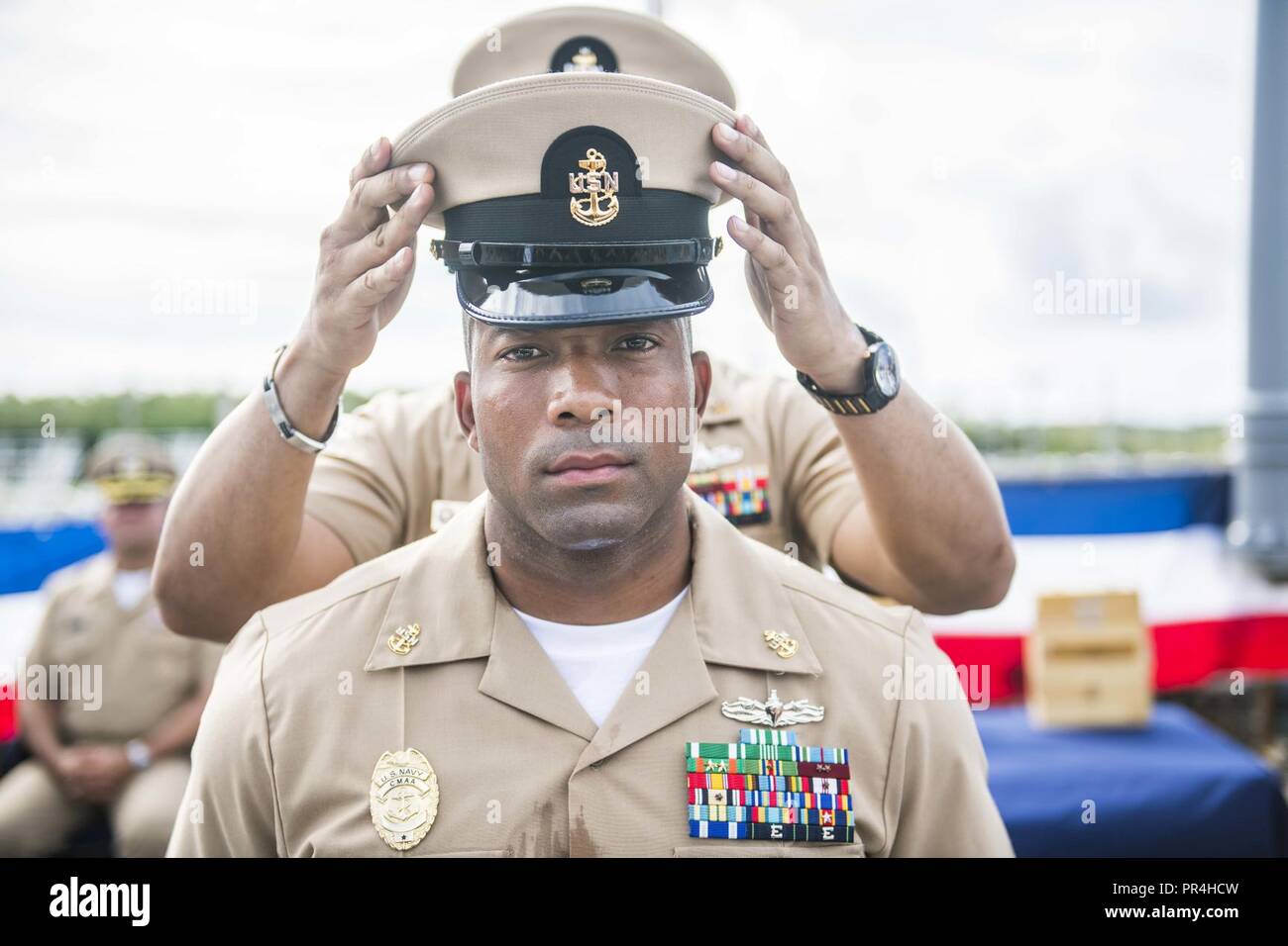 Chief Master-at-Arms Nicholas Graham, from Bradenton, Fla., receives ...