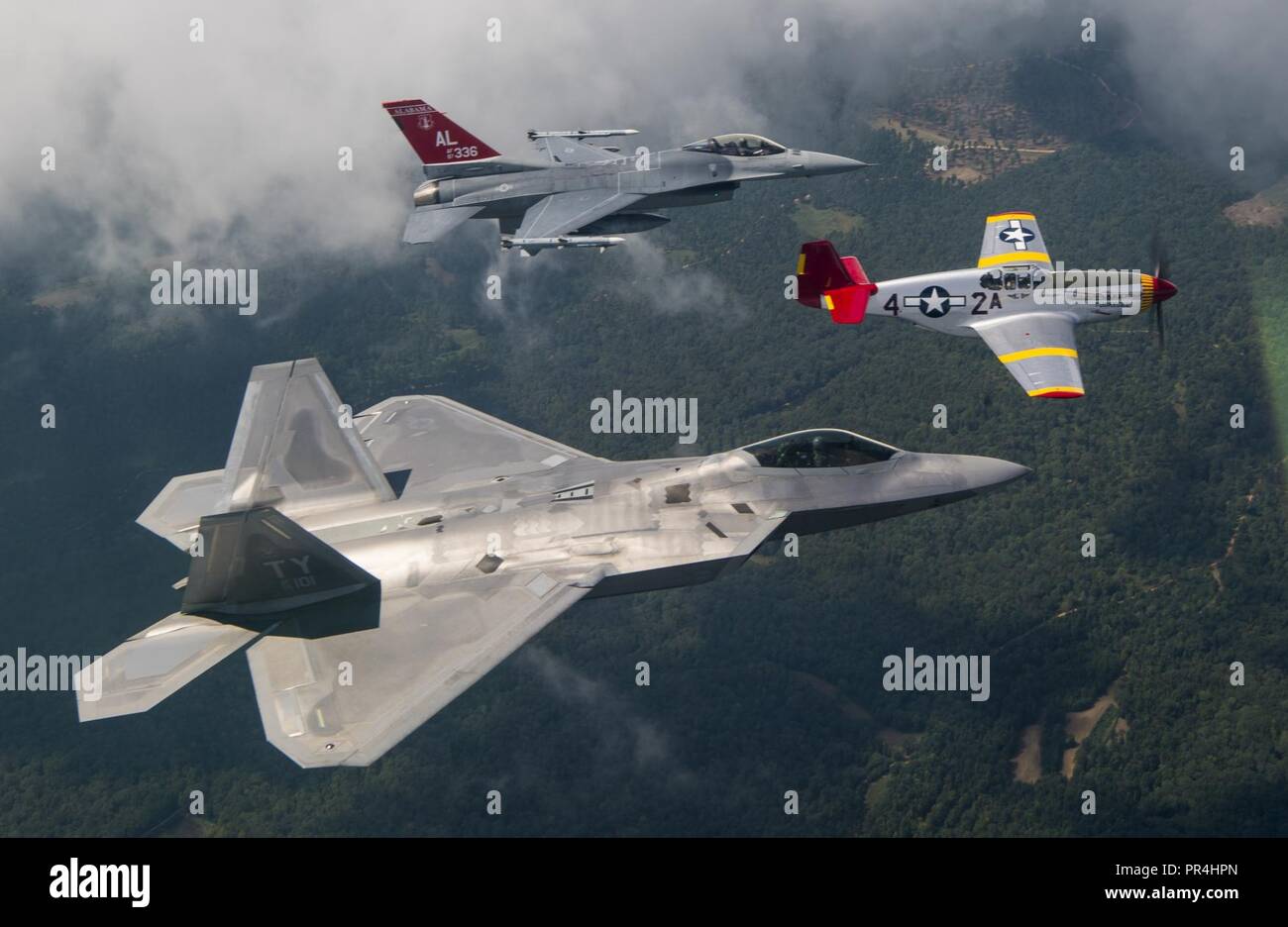 A U.S. Air Force F-22 Raptor, F-16 Fighting Falcon and a Commemorative ...