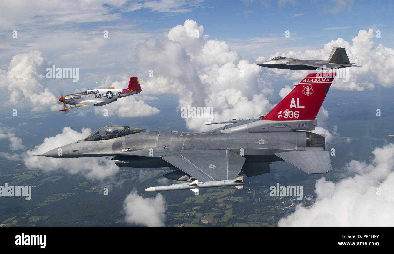 A U.S. Air Force F-22 Raptor, F-16 Fighting Falcon and a Commemorative ...