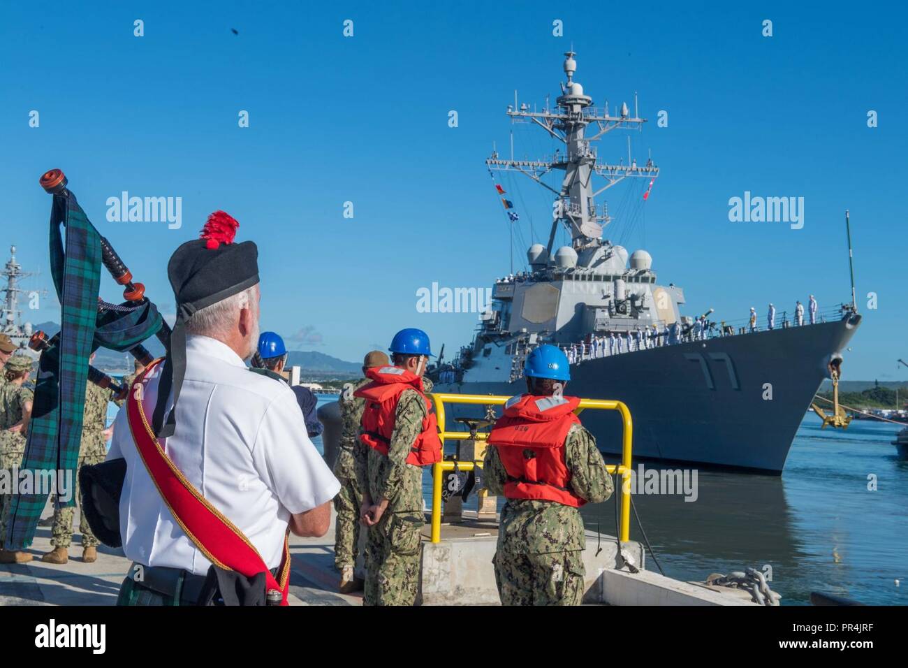 PEARL HARBOR (Sept. 14, 2018) A bagpipe player plays farewell to the ...