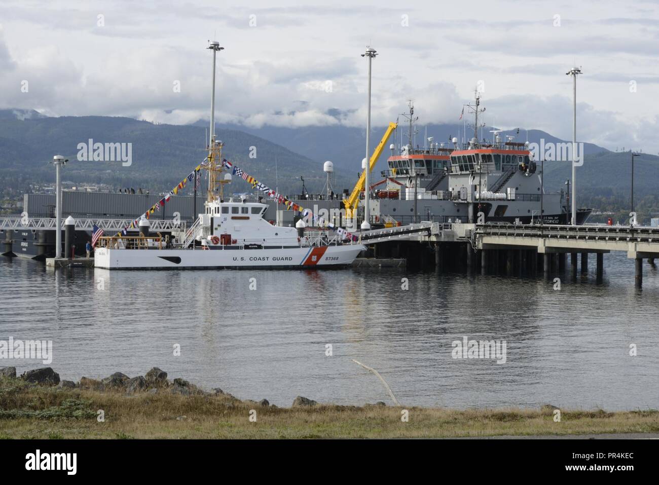 The Coast Guard Cutter Sea Devil (front), an 87-foot coastal patrol ...