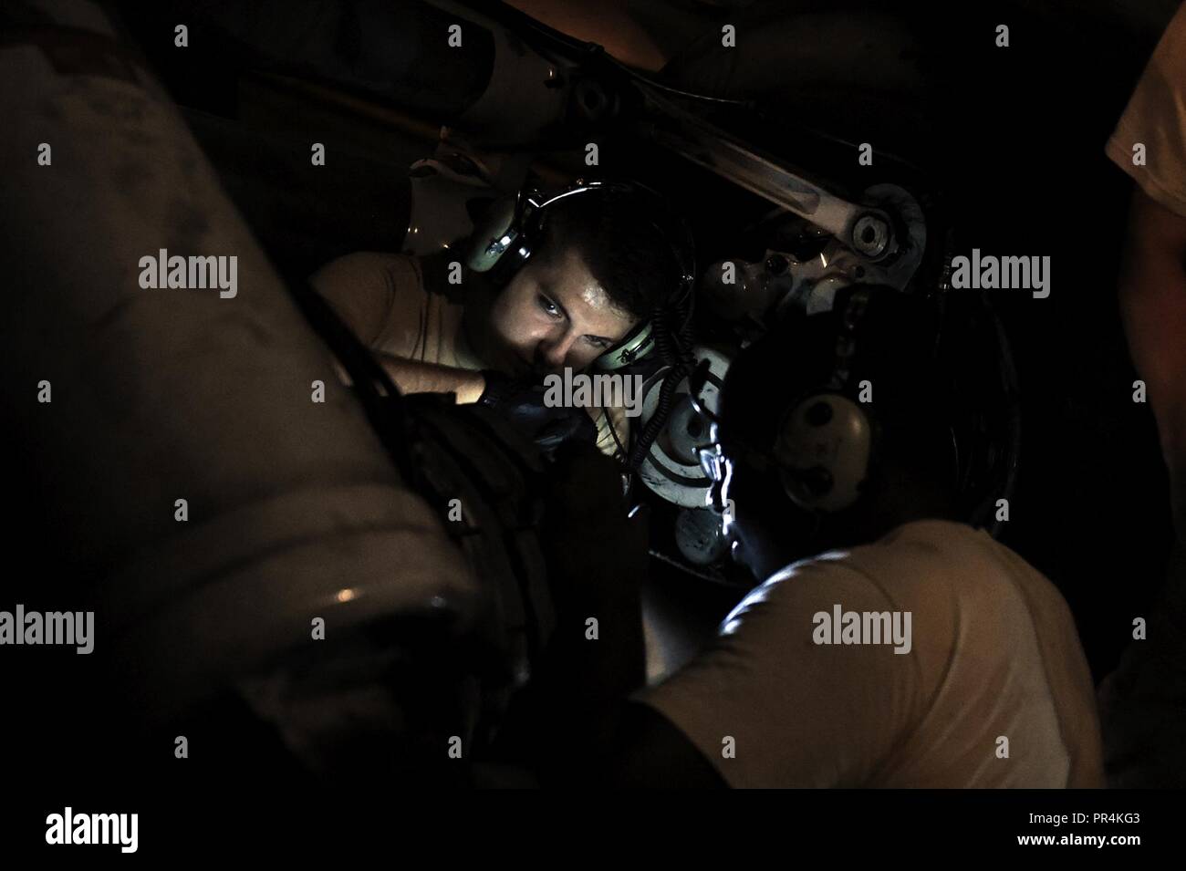 Airmen assigned to the 437th Aircraft Maintenance Squadron change a ...