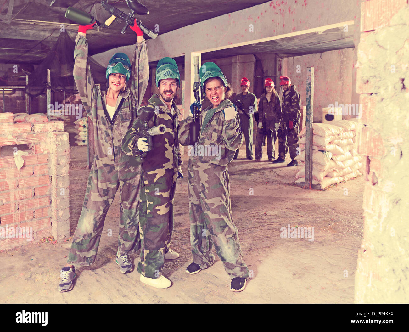 Team in blue is celebrating the victory in the paintball club Stock ...