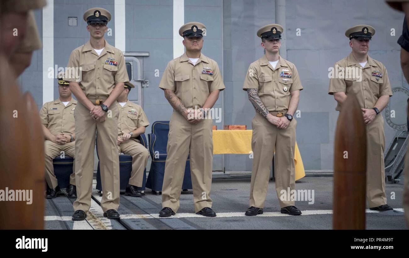 PHILIPPINE SEA (Sept. 14, 2018) Newly pinned chief petty officers stand ...