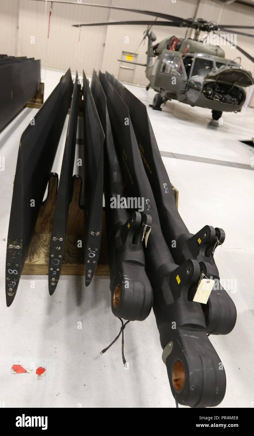 Blades for a UH-60 Black Hawk stand ready for use after a maintenance ...