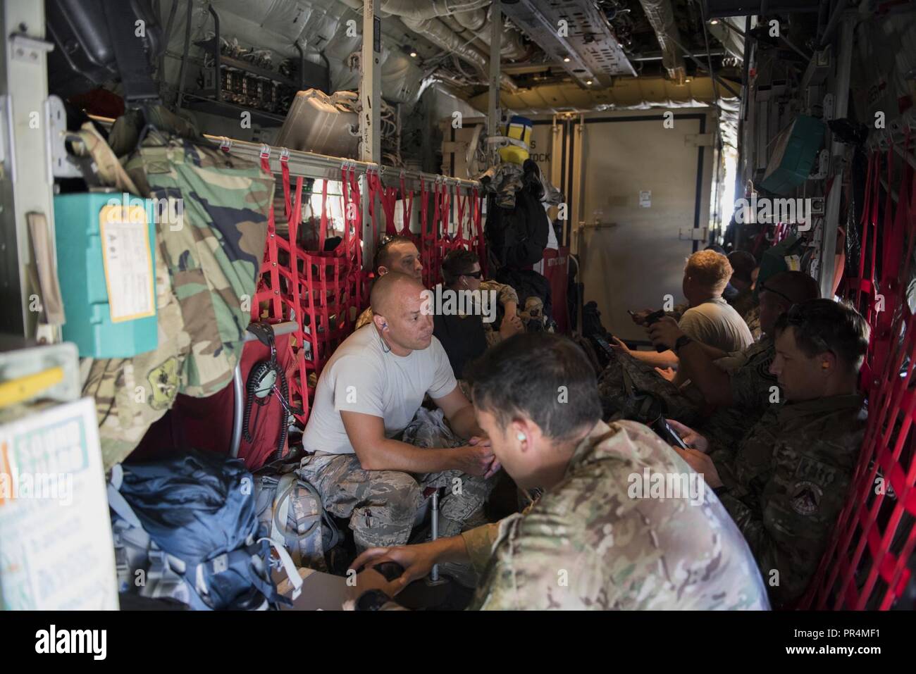 Airmen wait to depart on a HC-130J Combat King II, Sept. 15, 2018, at ...