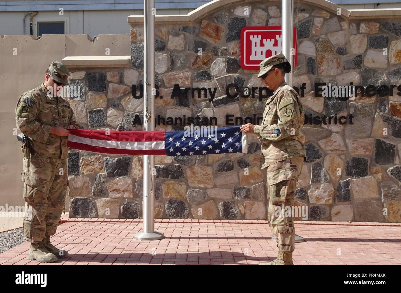 Precisely and uniformly the U. S. flag is being folded by SFC Michael ...